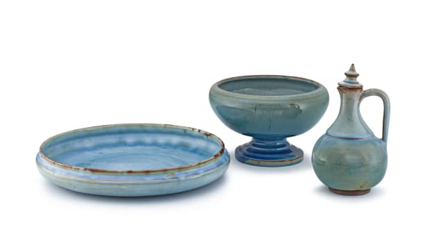 A Linn Ware blue-glazed bowl with brown highlights to the rim, raised ...