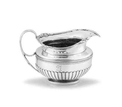 A George IV silver milk jug, maker's initials indistinct, Dublin, 1825 ...