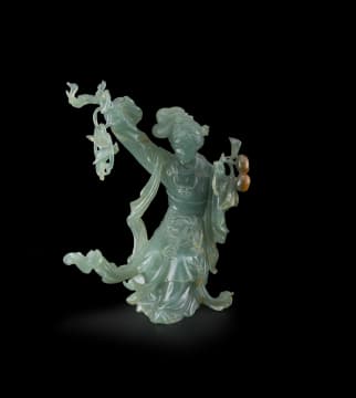 A Chinese carved jade figurine, Qing Dynasty, 20th century | Strauss & Co