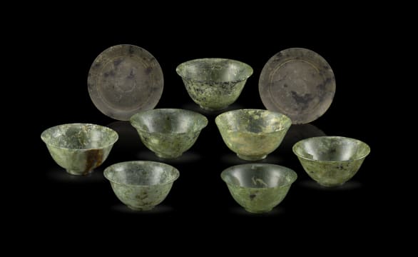 A set of seven Chinese carved mottled jade bowls, Qing Dynasty, 19th ...