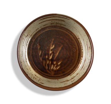 Brown-glazed stoneware dish with a wildgrass motif by Hyme Rabinowitz ...