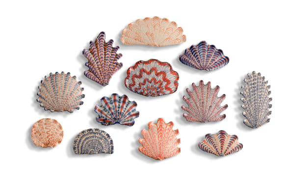 Curated collection of twelve glazed ceramic shells with various ...