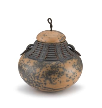 Pear-shaped ceramic pot with relief and incised neck band embellished ...