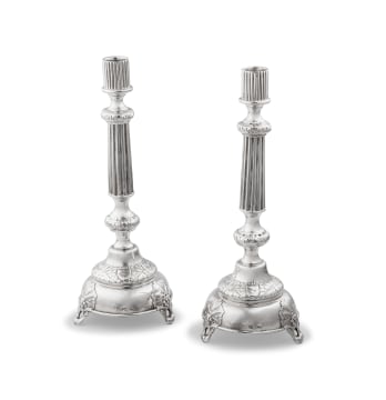 Pair of Russian silver candlesticks | Strauss & Co