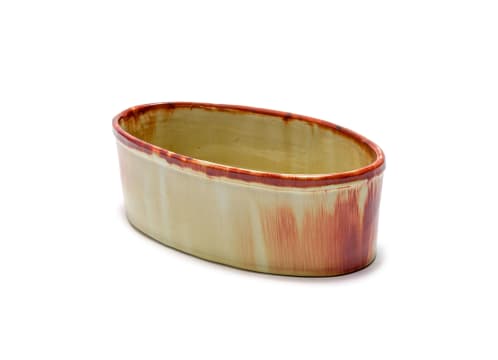 Yellow and brown oval dish by Linn Ware/Ceramic Studio | Strauss & Co