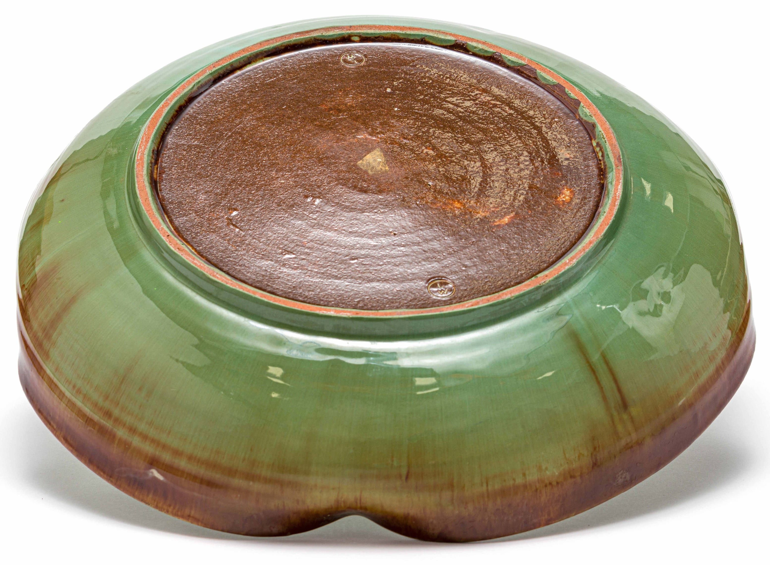 A Linn Ware leaf-green and russet-glazed petal-shaped dish | Strauss & Co