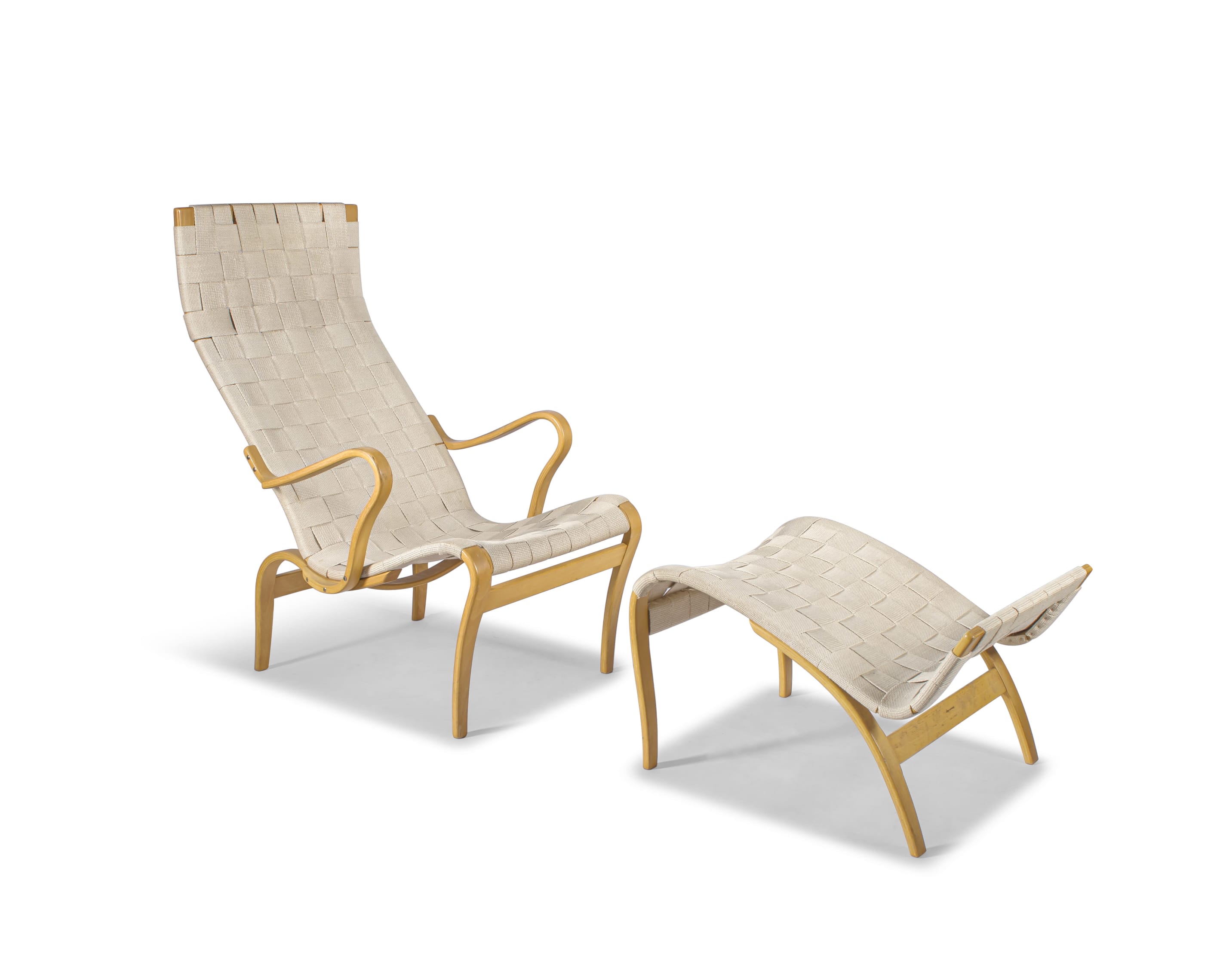 A Bruno Mathsson 'Pernilla' lounge chair and ottoman designed 1941 for ...