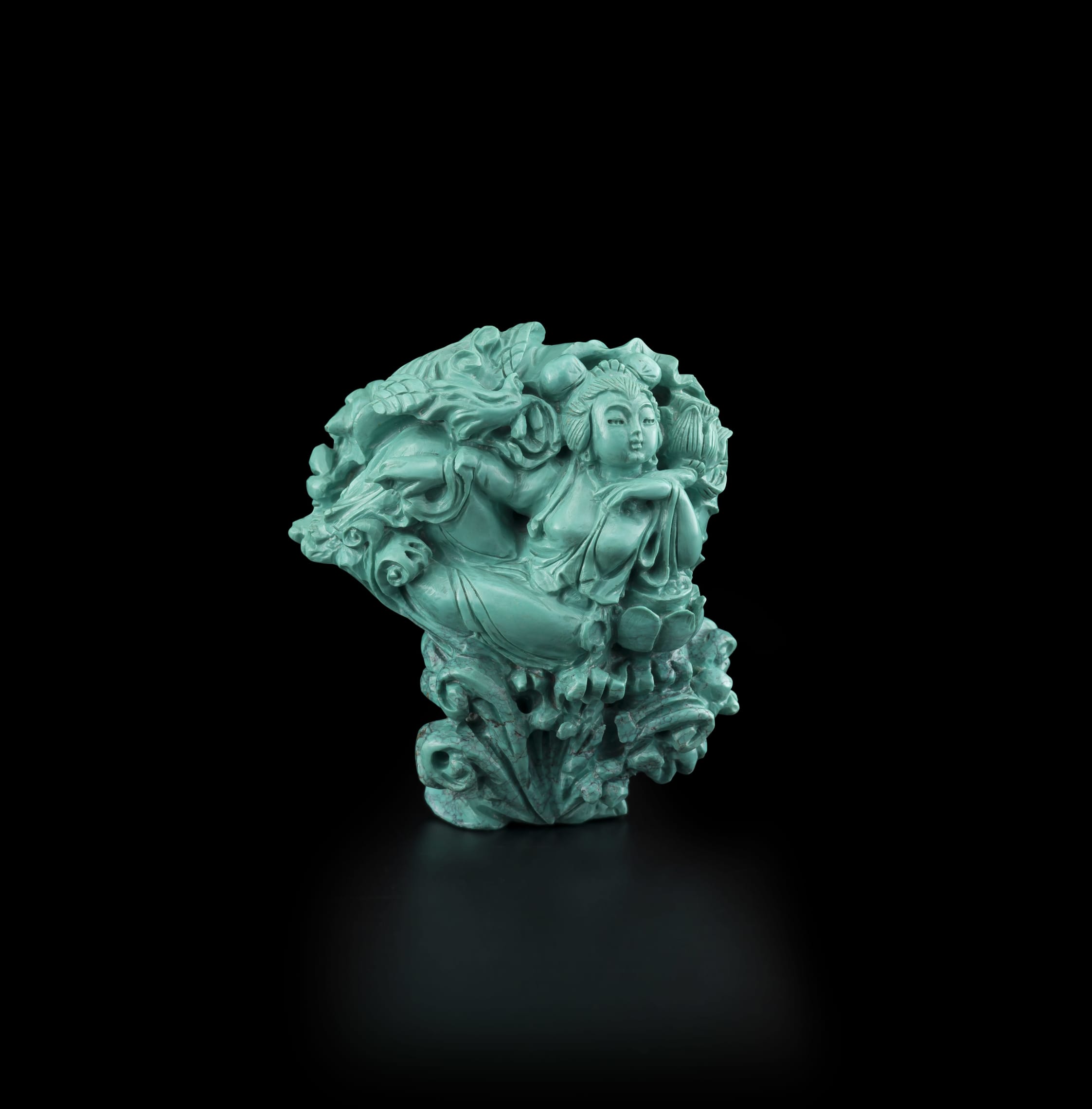 A Chinese carved turquoise figure, 19th century | Strauss & Co