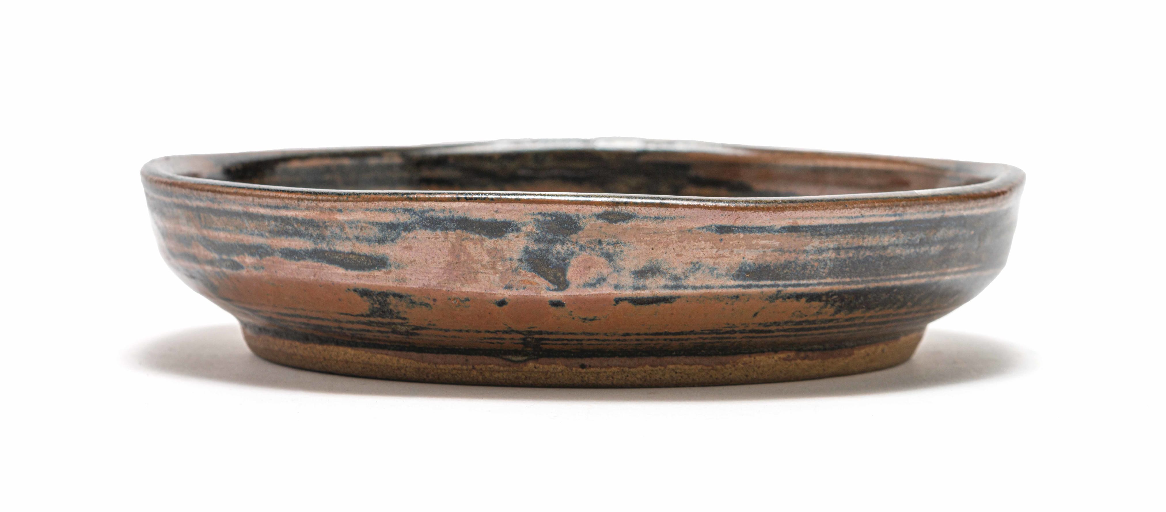Dish with circular abstract motif by Yvonne Levy | Strauss & Co