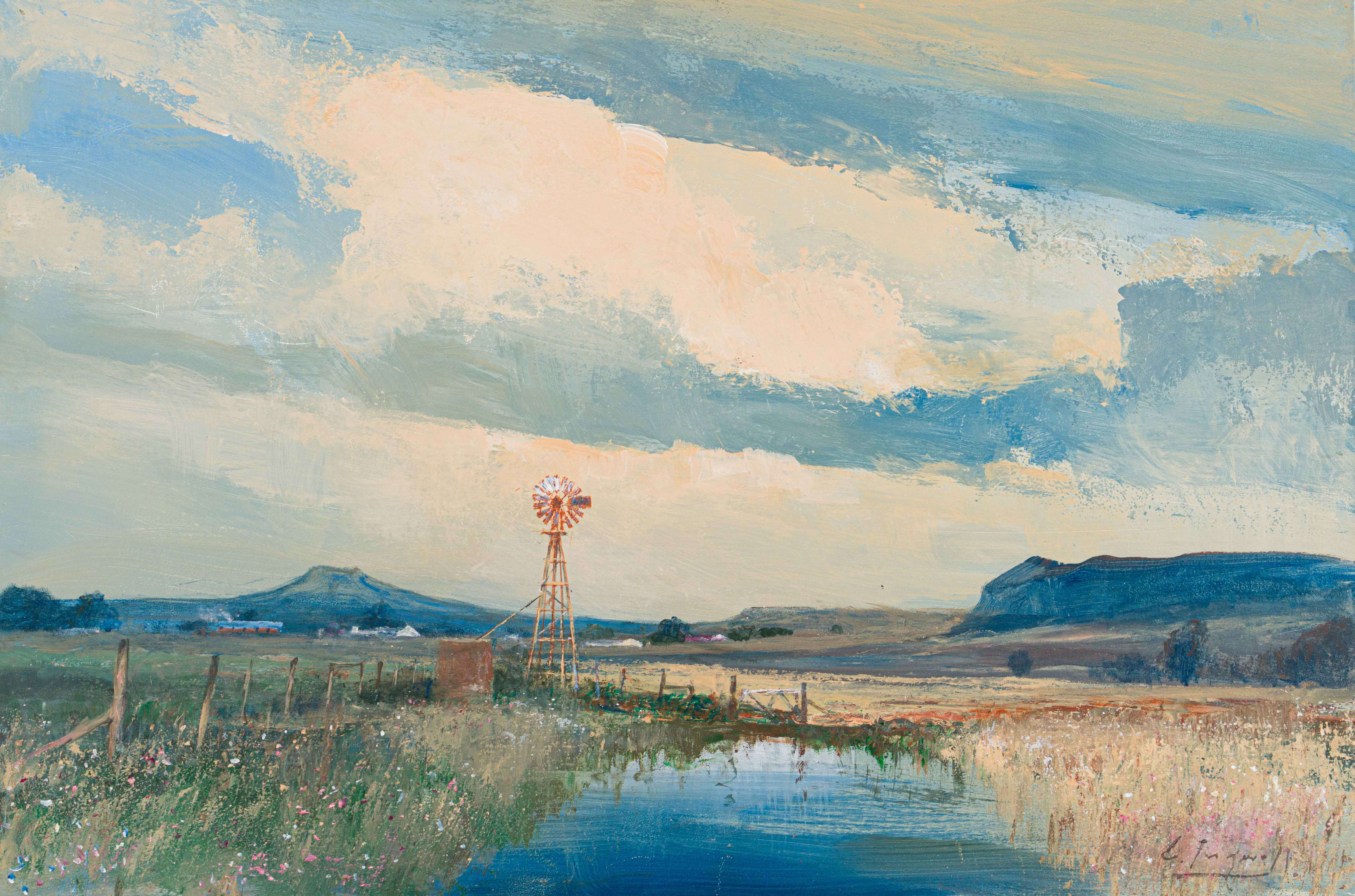 Windmill in a Grassy Landscape with Mountains in the Distance by ...