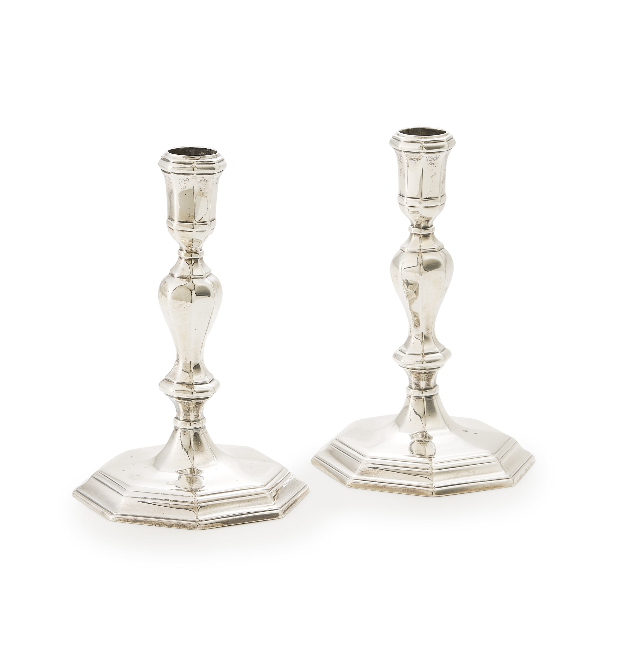 A pair of George III silver candlesticks, Ebenezer Coker, London, 1769 ...