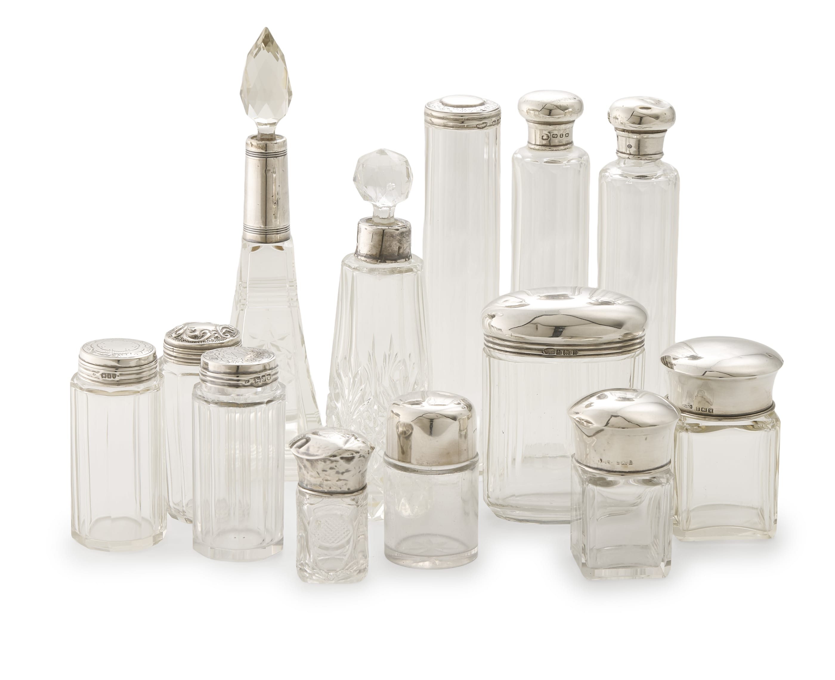 A miscellaneous group of Victorian silver-mounted glass bottles, Walter ...